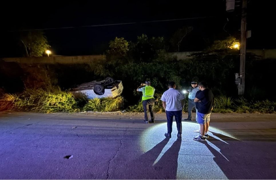 Driver taken to hospital after rolling taxi off highway overpass ...